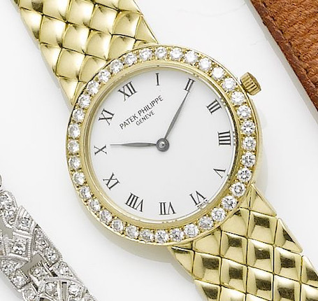 Bonhams : Patek Philippe. A lady's 18ct gold quartz bracelet watch