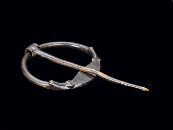 Bonhams : An Irish bronze zoomorphic penannular brooch