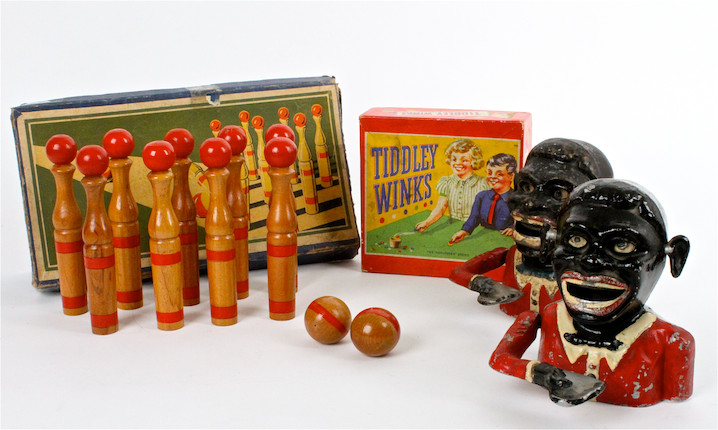 Bonhams : A pair of aluminium Jolly Nigger money banks