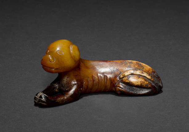 Bonhams : A mottled brown nephrite, or other stone carving of a ...