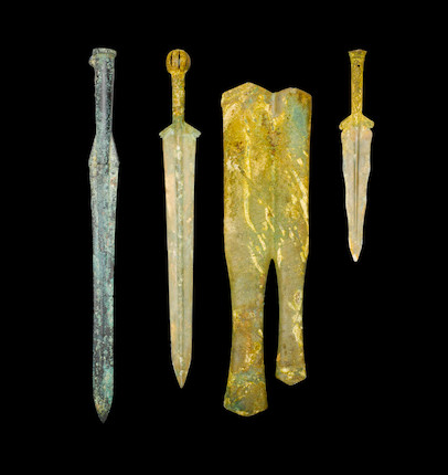 Bonhams : A bronze pi, two bronze swords and a scabbard Zhou dynasty
