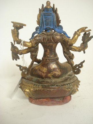 Bonhams : A gilt six armed deity, possibly Mahamayuri Tibetan, 18th Century