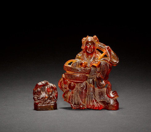 Bonhams : Two pressed amber sculptures, including one designed as two ...