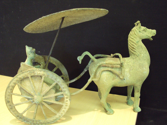 Bonhams : A Chinese reproduction model of a metal horse and cart