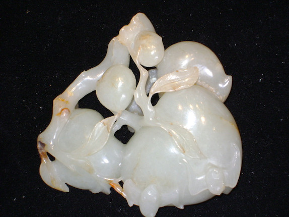 Bonhams : A celadon jade carving of a peach and bat group