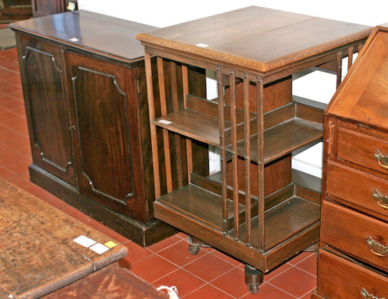Bonhams : An oak revolving bookcase,60cm square and a mahogany dwarf ...