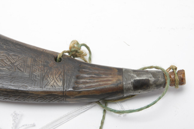 Bonhams : A large Scottish cow horn powder flask, probably 19th century