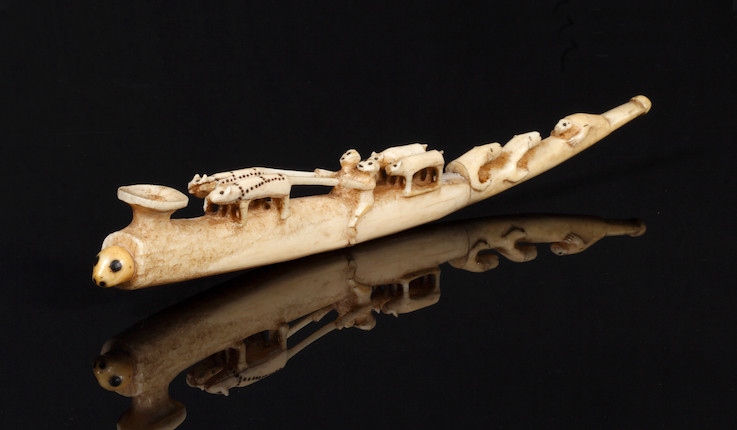 Bonhams : An Inupiaq walrus ivory pipe Inupiat Eskimo, Alaska 28cm long