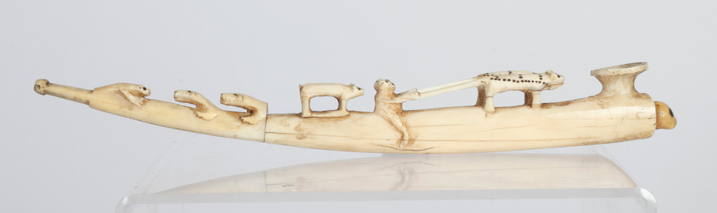 Bonhams : An Inupiaq walrus ivory pipe Inupiat Eskimo, Alaska 28cm long
