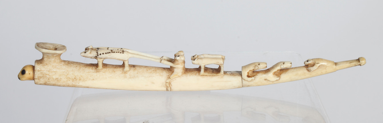 Bonhams : An Inupiaq walrus ivory pipe Inupiat Eskimo, Alaska 28cm long