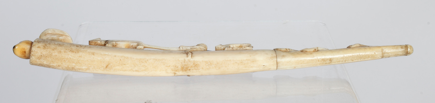 Bonhams : An Inupiaq walrus ivory pipe Inupiat Eskimo, Alaska 28cm long