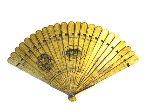 Bonhams : A heavily gilt lacquered brisé fan Early to mid 19th century