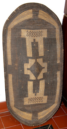 Bonhams : A wicker shield Central Africa 107cm high