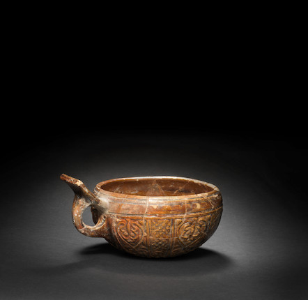 Bonhams : A large Umayyad/ early Abbasid monochrome moulded-pottery Cup ...