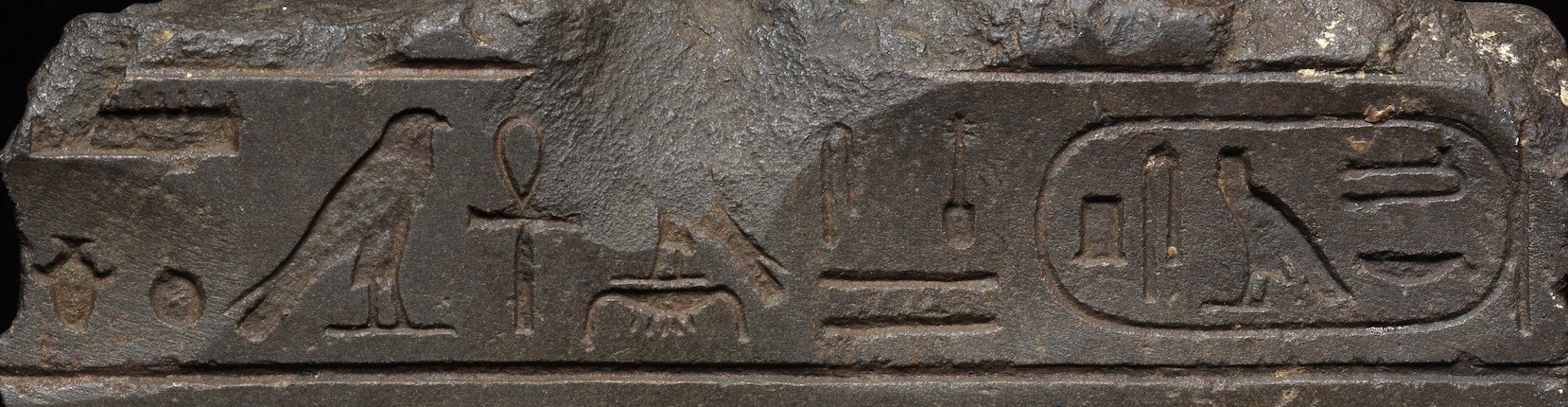 Bonhams : An Egyptian basalt inscribed base of a sphinx for King Psamtik II