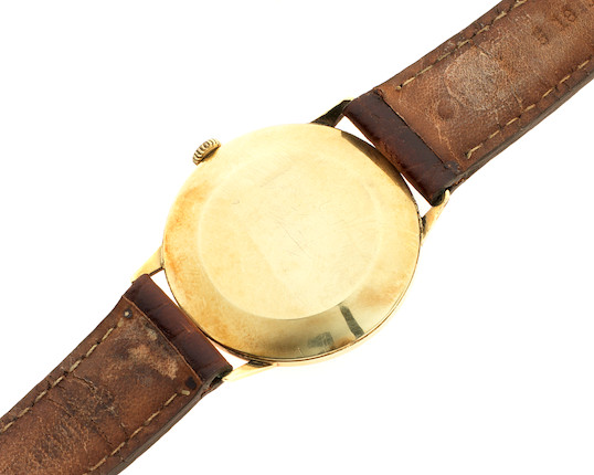 Bonhams : Tusal. A 14K gold manual wind wristwatch
