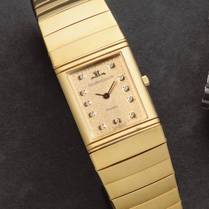 Bonhams : Jaeger-LeCoultre. An 18K gold quartz reversible rectangular ...