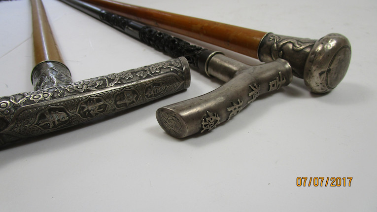 Bonhams : Three silver topped walking canes 19th century