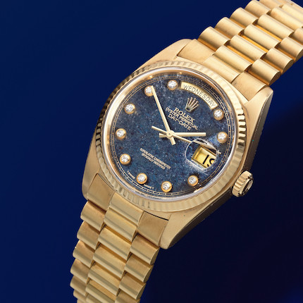 Bonhams : Rolex. An 18K gold automatic calendar bracelet watch with ...