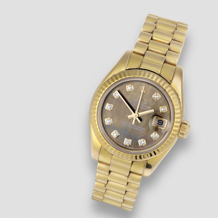 Bonhams : Rolex. A lady's 18K gold and diamond set automatic calendar ...