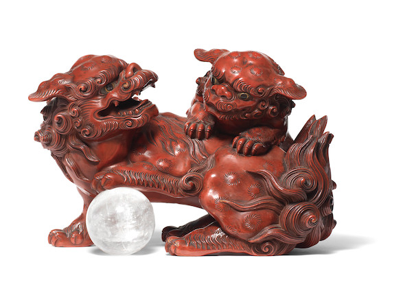 Bonhams : A red-lacquered wood group of two shishi (Chinese ...
