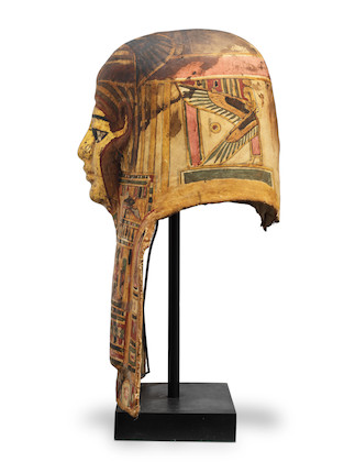 Bonhams : An Egyptian gilt polychrome painted cartonnage mummy mask
