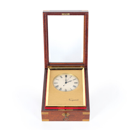 Bonhams : Patek Philippe. A brass and plastic cased quartz desk clock with mahogany presentation ...
