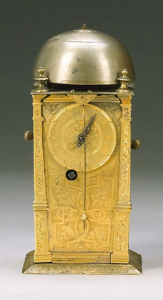 Bonhams : A 17th century engraved gilt brass German table clock 12cms ...