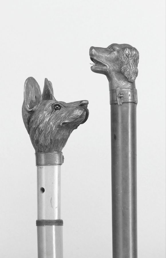 Bonhams : A Tyrolean carved wooden dog parasol handle,