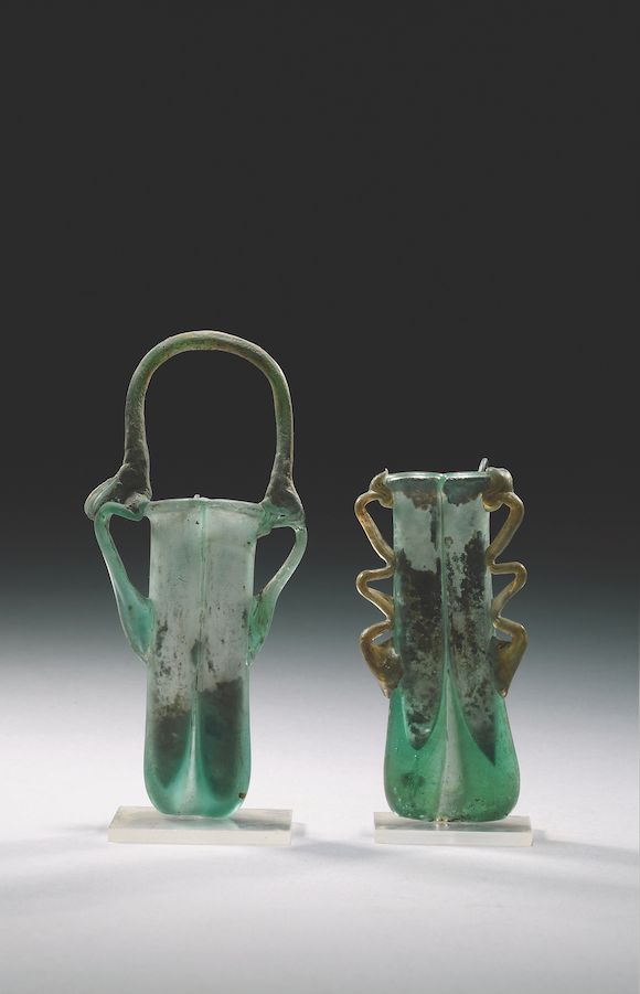 Bonhams : Two Roman glass balsamaria and a glass stiring rod, circa 4th ...