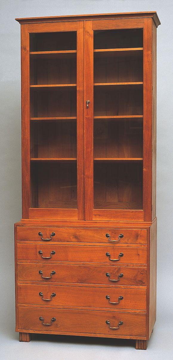 Bonhams : By Hugh Birkett: A hardwood bookcase on chest,