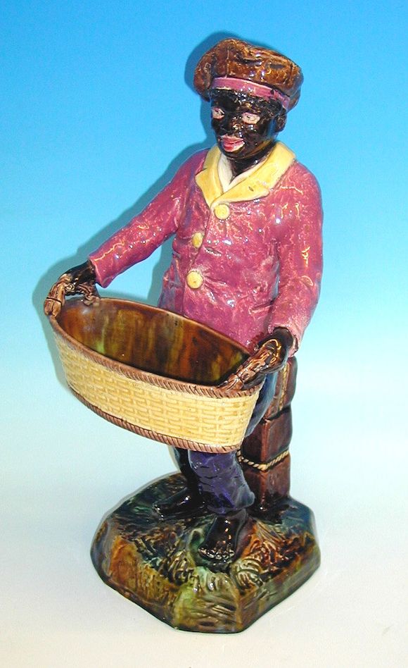 Bonhams : A majolica pottery figure of a negro man,