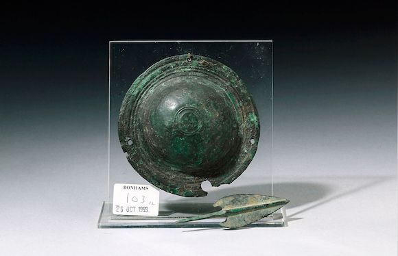 Bonhams : A Persian bronze shield boss and a Persian tanged arrow head (2)