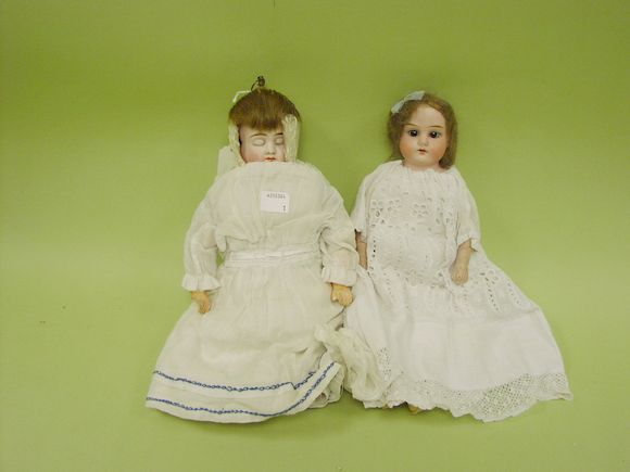 Bonhams : A rare three faced doll, circa 1910 together with a bisque ...