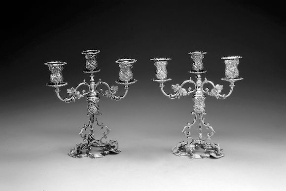 Bonhams : A pair of modern Irish silver-gilt cast three light dwarf ...