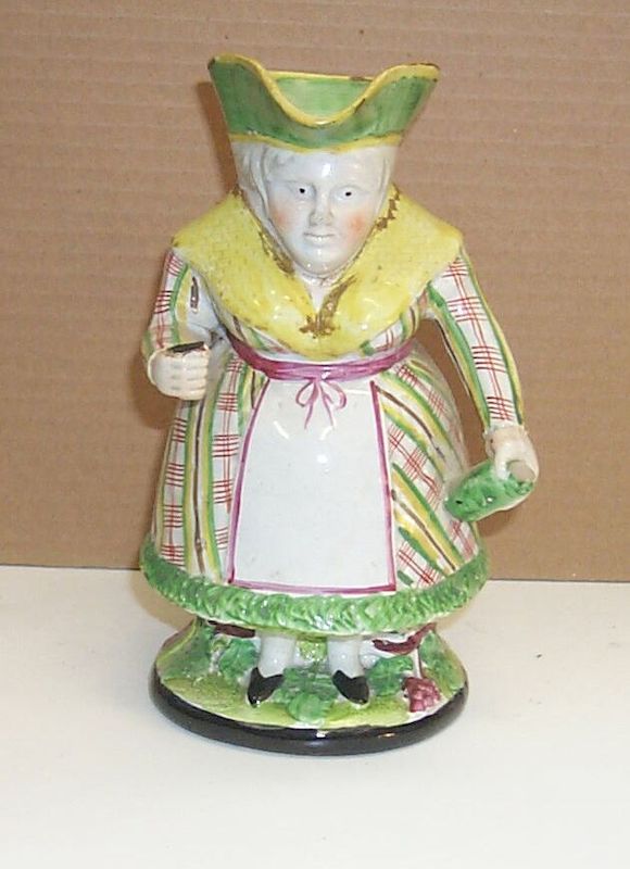 Bonhams : A Scottish 'Gin Woman' Toby jug, circa 1840,