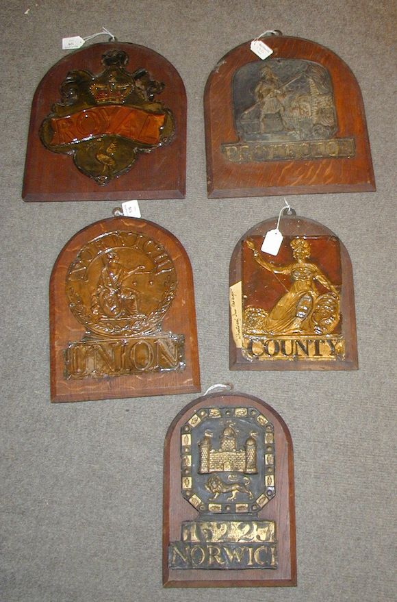 Bonhams : A collection of seven painted pressed tin and copper fire marks,