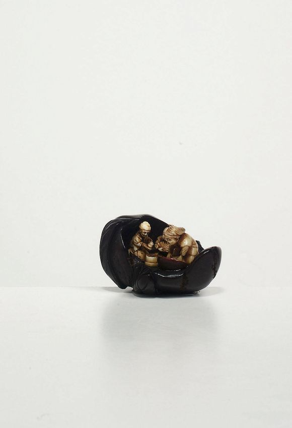 Bonhams : Ivory and wood netsuke, three figures and lotus flower