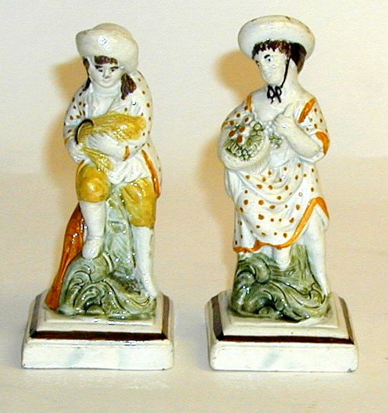 Bonhams : A pair of Prattware figures of a boy and girl, circa 1820,