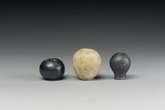 Bonhams : Three Ancient Near Eastern stone mace-heads (3)