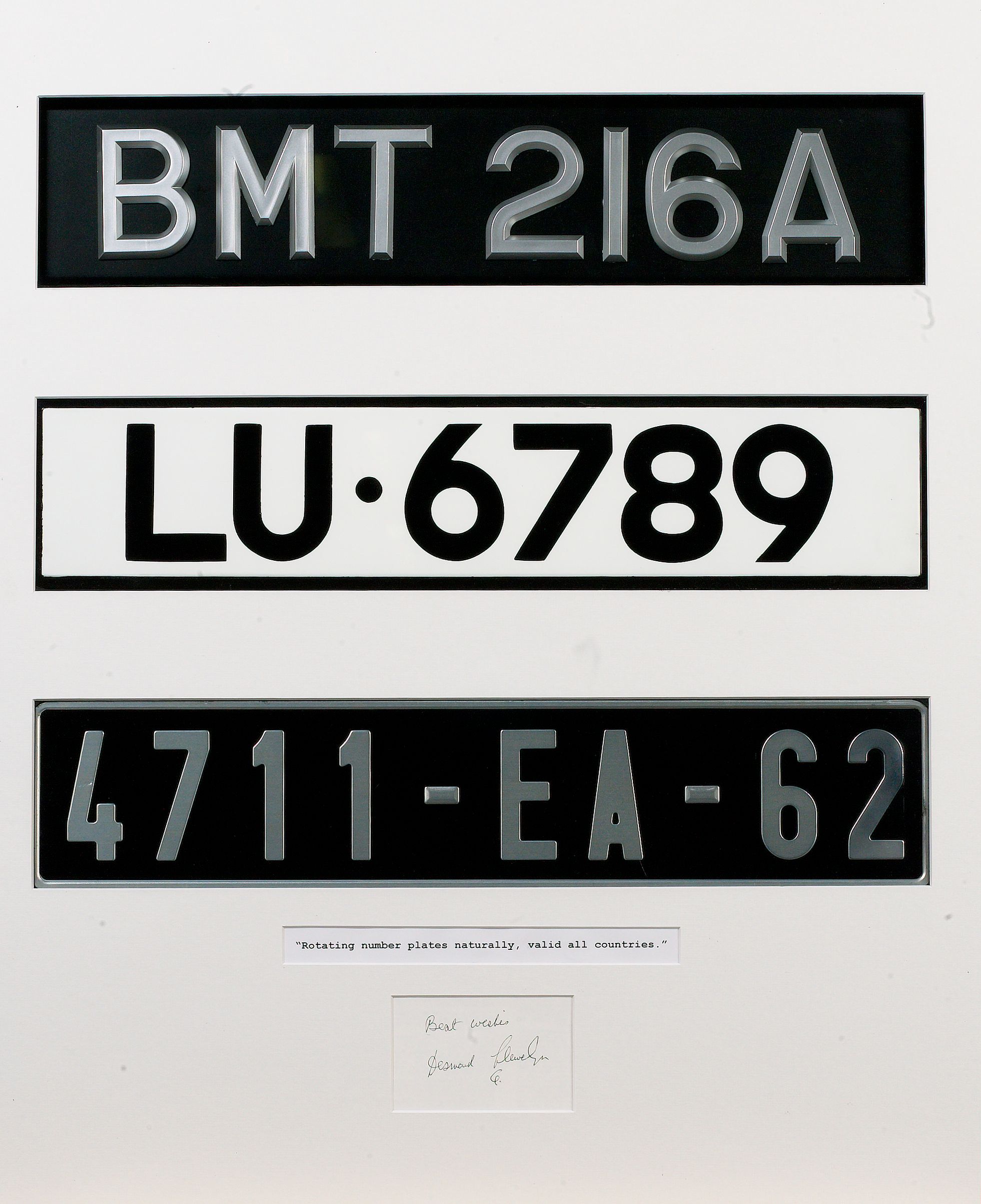 Bonhams Cars : A display of three 'rotating' number plates,