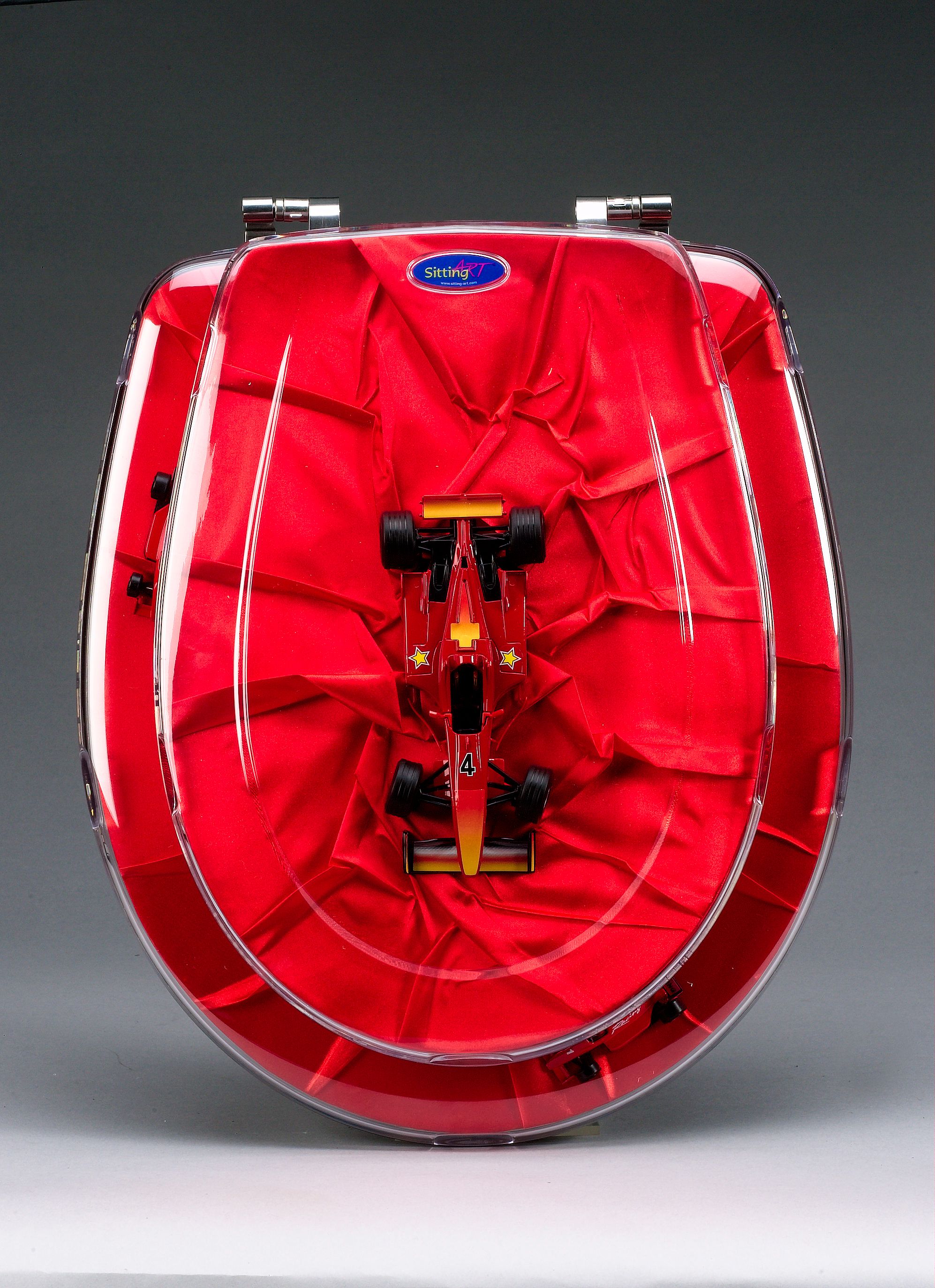 Bonhams Cars : A perspex red racing car toilet seat,