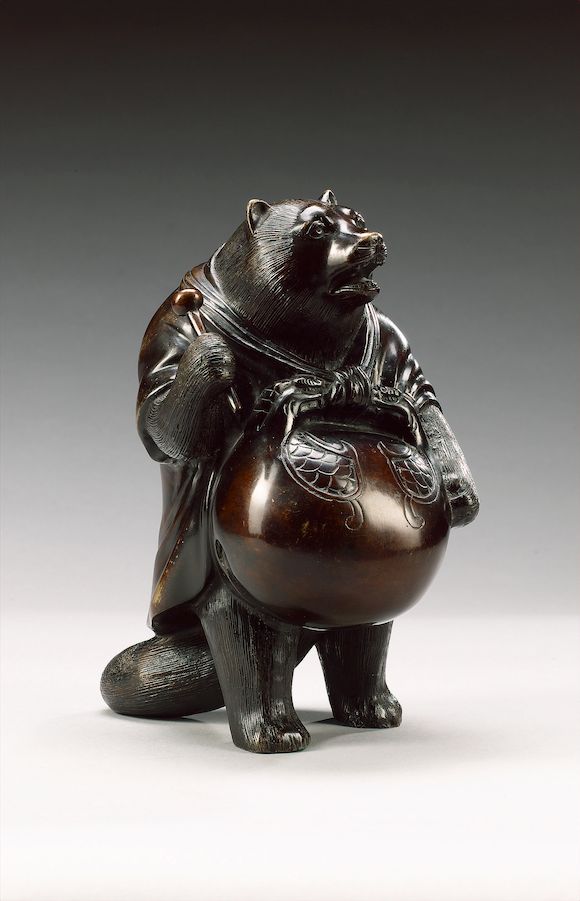 Bonhams : An elegant bronze figure of a standing tanuki,