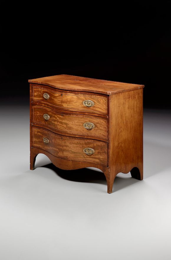 Bonhams : A late George III mahogany and chevron banded serpentine commode