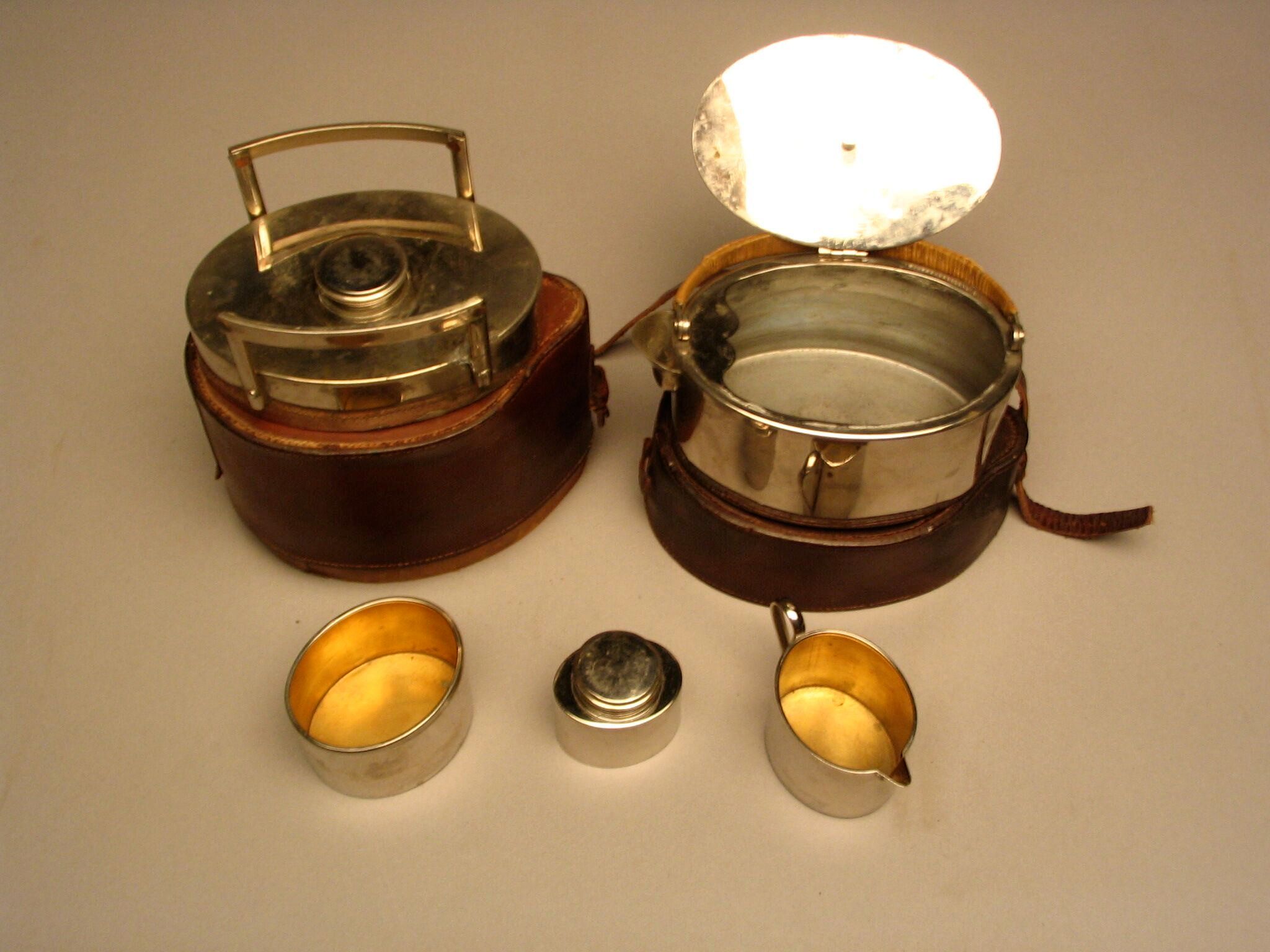 Bonhams Cars : A leather cased one person tea set,