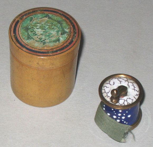 Bonhams : A rare Staffordshire enamel cylinder tape measure,