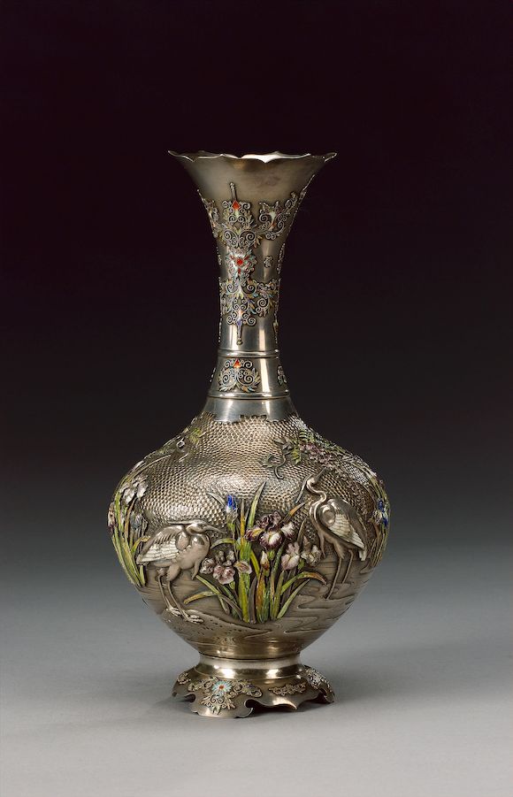 Bonhams : A white-metal oviform vase with trumpet neck and shaped ...