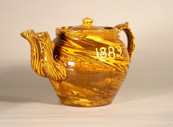 Bonhams : A Staffordshire slip ware double spouted teapot and cover ...