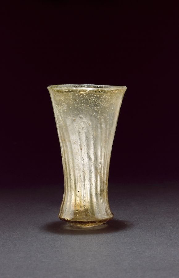 Bonhams : A Merovingian fine greenish-yellow glass bell-beaker