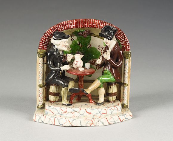 Bonhams : A pearlware 'Dr Syntax' card playing group, circa 1825,